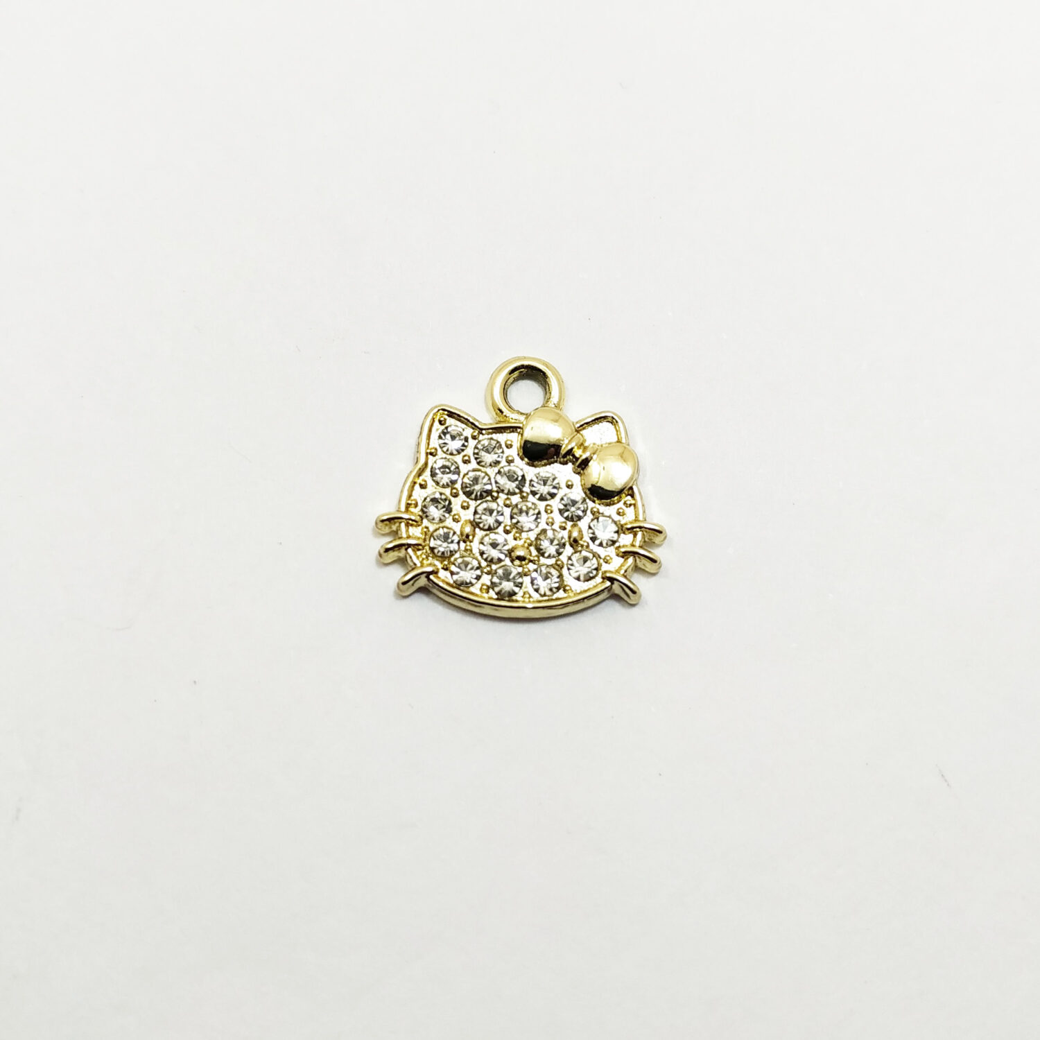 Dije con strass hello kitty dorado – Filigranas Insumos